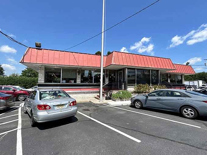 That red roof and classic diner architecture practically scream "pull over immediately for breakfast excellence."