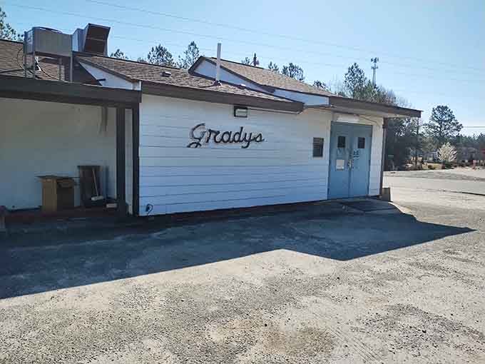 The unassuming side view of Grady's shows smoke stacks hard at work, turning whole hogs into Carolina barbecue magic daily.