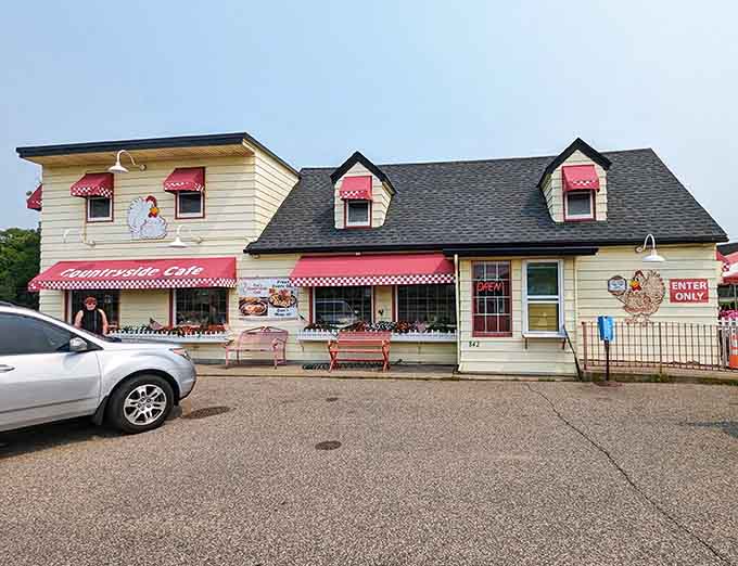 That cheerful chicken perched above the awning knows exactly what treasures await inside this charming yellow building.