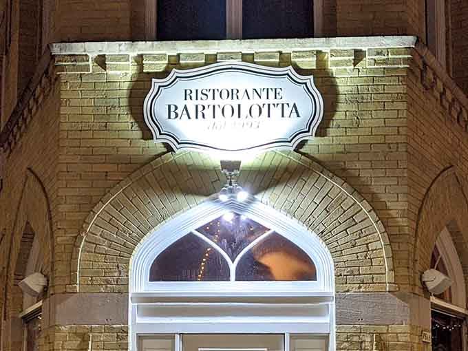 That illuminated archway and brick facade whisper "old brewery" but promise authentic Italian cuisine that'll make you forget Wisconsin winters.