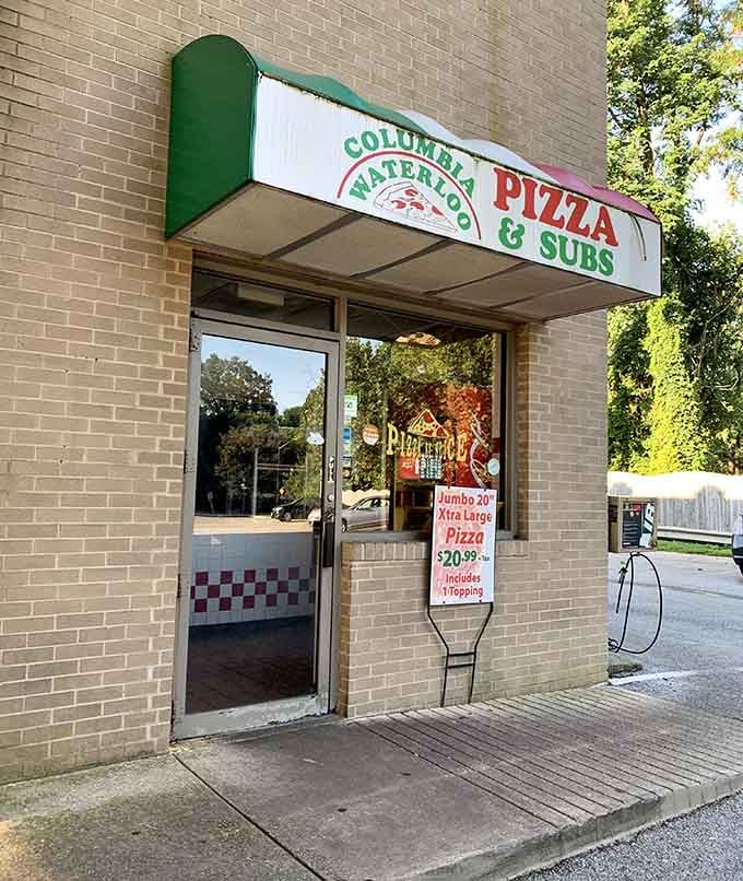 That unassuming storefront holds the kind of pizza magic that makes you question everything you thought about gas stations.