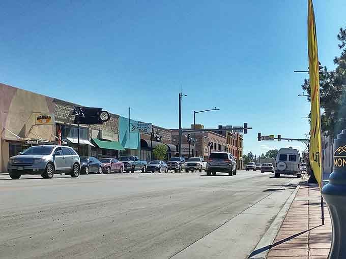 Main Street stretches wide under endless blue sky, where parking is plentiful and stress is optional.
