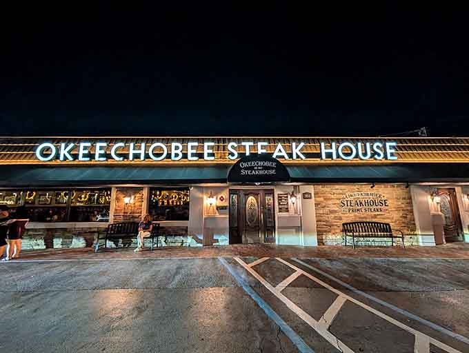 That glowing sign isn't just calling your name, it's practically singing a siren song of perfectly grilled steaks.