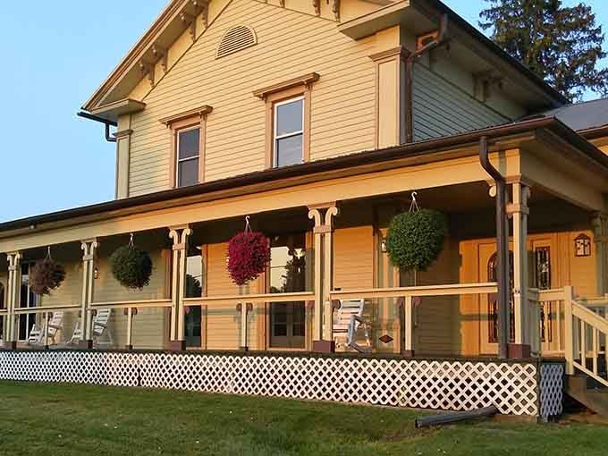That welcoming front porch with hanging flower baskets says "come sit a spell" louder than any neon sign ever could.