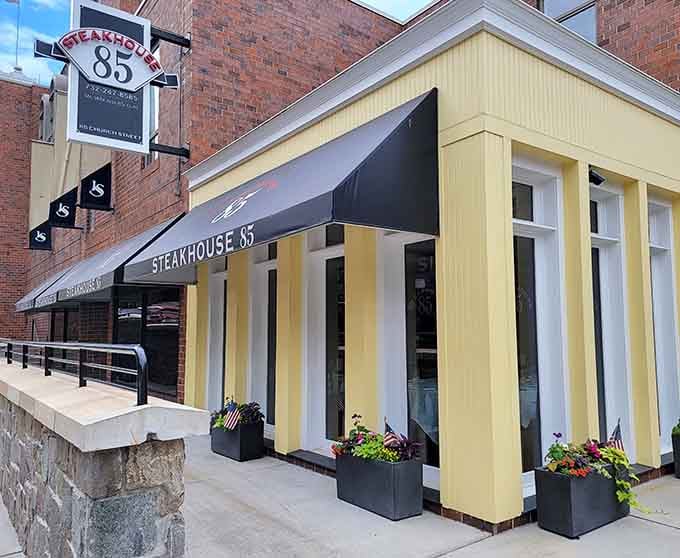 The sleek exterior with those cheerful planters proves that a steakhouse can look modern without losing its welcoming soul.