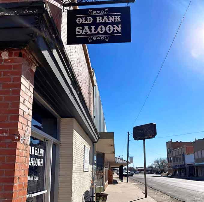 Classic small-town Texas architecture meets blue sky perfection, proving that sometimes the journey really is the destination itself.