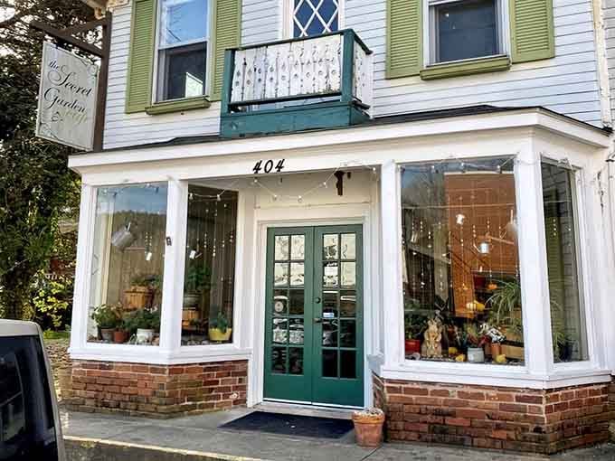 Green shutters and flower boxes frame this storybook entrance where breakfast dreams become delicious reality.