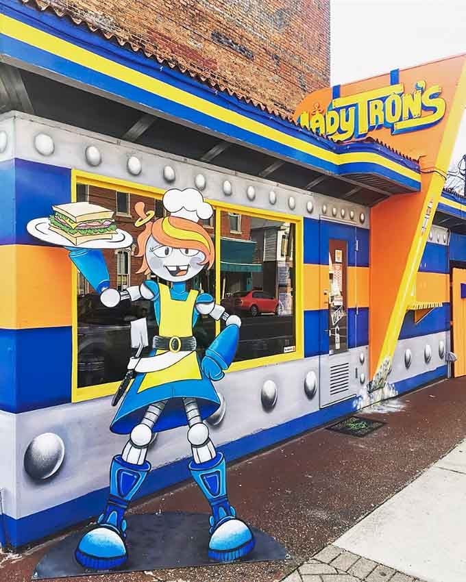 That robot mascot isn't just standing guard – it's practically begging you to come inside for lunch.