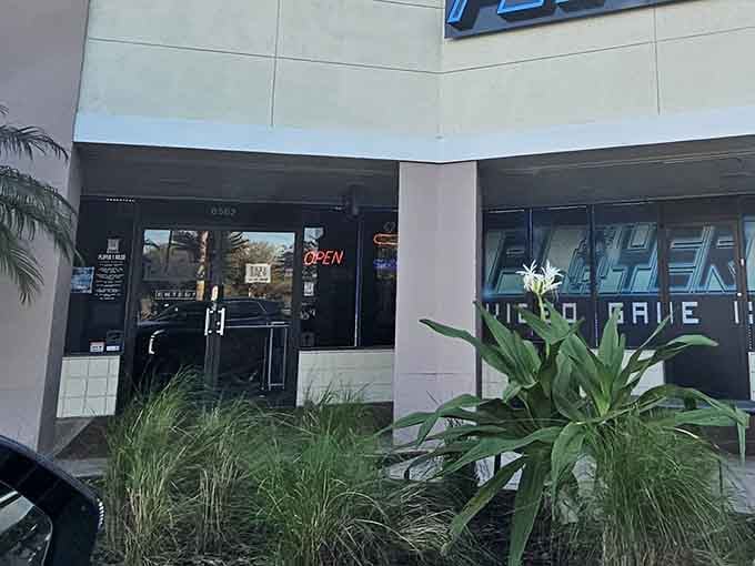 That glowing "OPEN" sign is your portal to an evening where quarters meet cocktails and nostalgia tastes delicious.