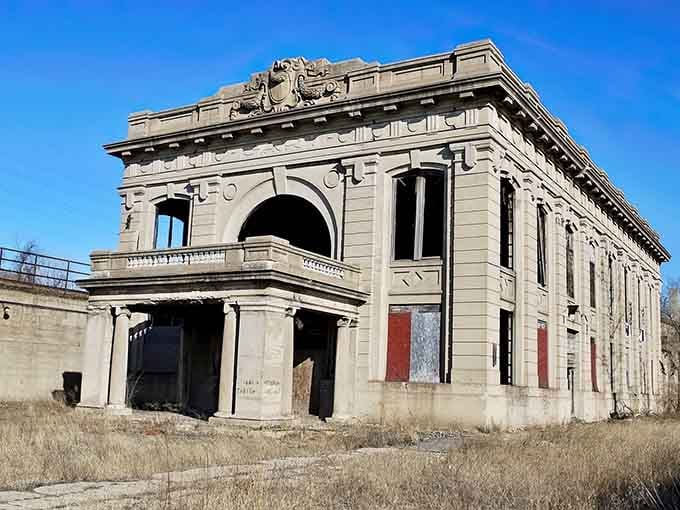 The grand facade still commands respect, even with nature slowly reclaiming what humans built with such confidence.