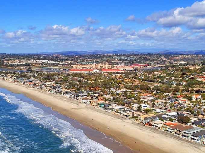 The Del Mar Racetrack's iconic red roofs reminding you that this town knows how to balance elegance with easy-going beach vibes.