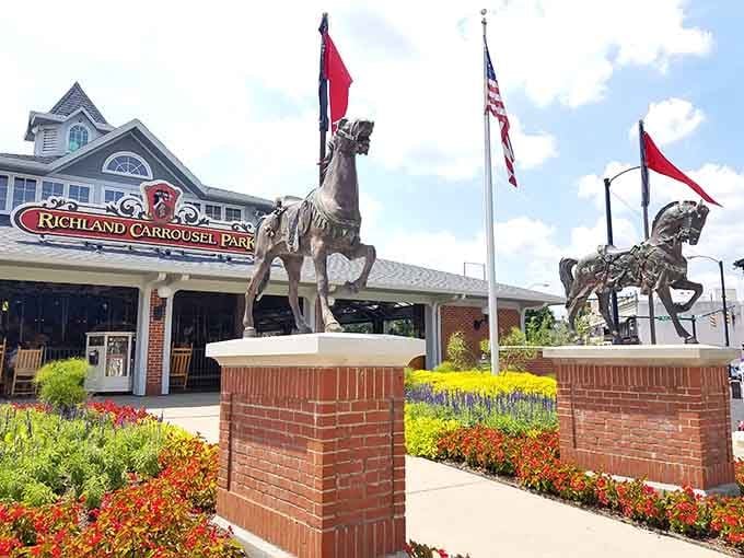 Those bronze carousel horses standing guard outside aren't just lawn ornaments, they're your first hint that childhood awaits inside.