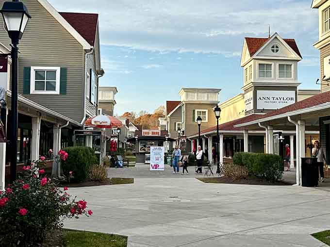 That charming village-style architecture makes you forget you're actually hunting for designer bargains at outlet prices.