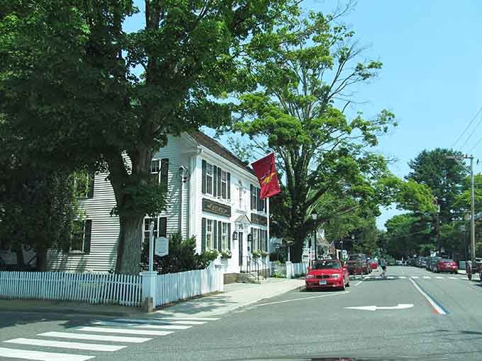 Those white picket fences aren't just decorative, they're a lifestyle choice that somehow makes everyone who walks past them instantly more relaxed.