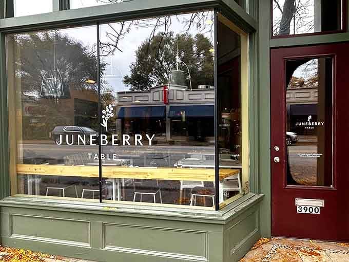 That sage green storefront with the burgundy door isn't just charming, it's your gateway to breakfast bliss.