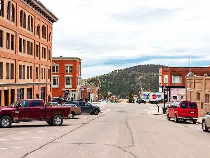 Main Street meets mountain majesty in Victor, where authentic Old West architecture frames peaks that've witnessed centuries. 