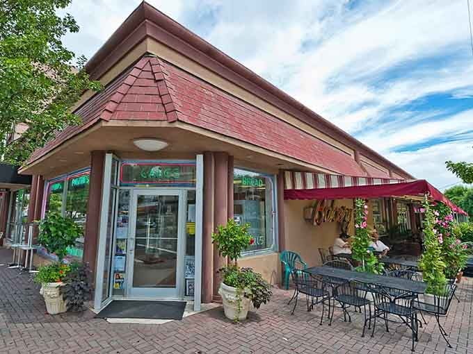 That charming storefront practically whispers "come inside" while the outdoor seating says "stay awhile and enjoy life."