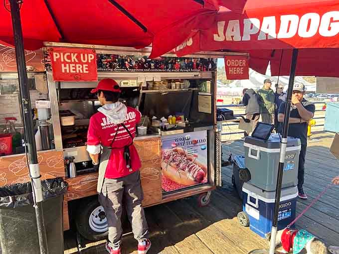 Under that cheerful red canopy, culinary magic happens where teriyaki meets the American dream on a bun.