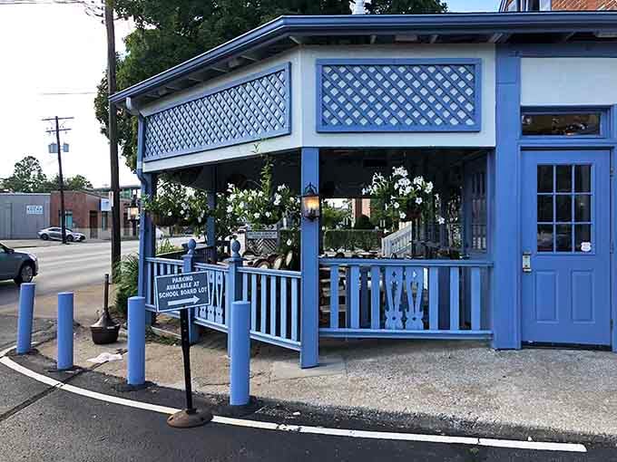 That charming blue-trimmed exterior is your first clue that something special awaits inside this Lexington gem.