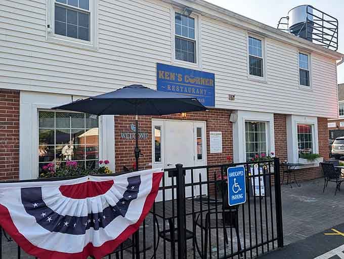That cheerful coffee cup sign hanging outside is basically waving you in for breakfast like an old friend.