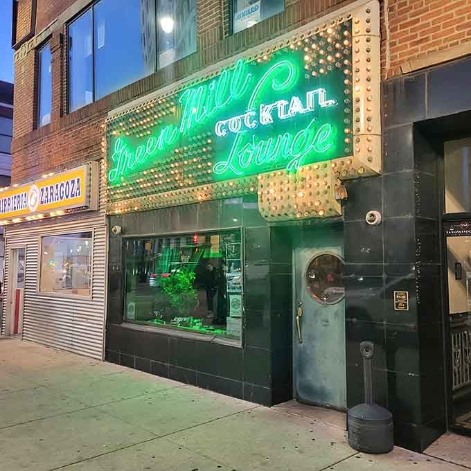 That vintage neon glow isn't a reproduction, it's the real McCoy welcoming you to jazz history.