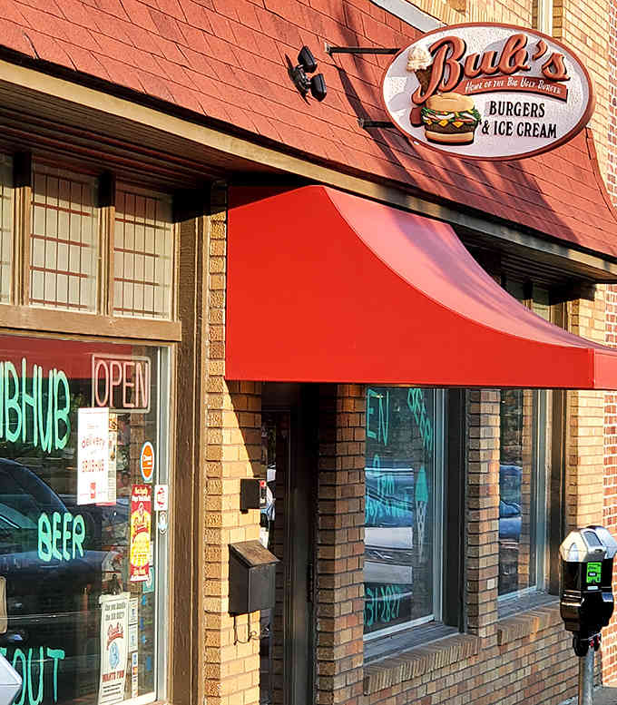 That red awning beckons like a lighthouse for the hungry, promising burger salvation in downtown Bloomington.