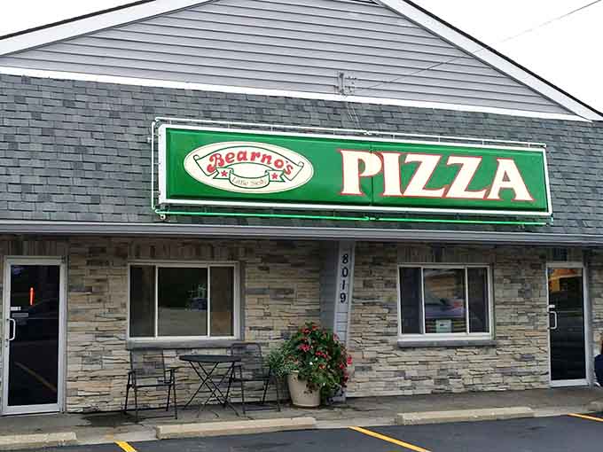 That green and white sign isn't just marking a building, it's pointing you toward pizza salvation in Louisville.