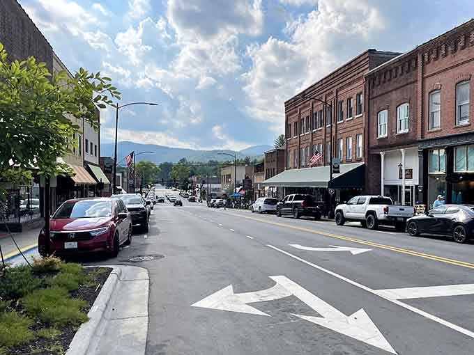 Main Street Brevard stretches out like a postcard from a simpler time, mountains watching over brick buildings.