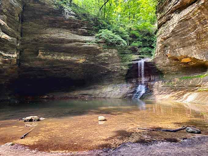 Nature carved this sandstone amphitheater over millions of years, complete with a waterfall that's pure Illinois magic.