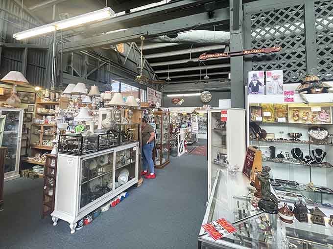 Wide aisles invite exploration through booth after booth of antiques, vintage furniture, and collectibles that span multiple decades of American history.