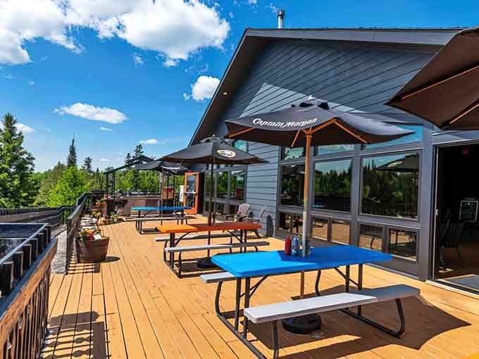 Behold the patio that launched a thousand canceled plans, where blue skies meet picnic tables in perfect harmony.