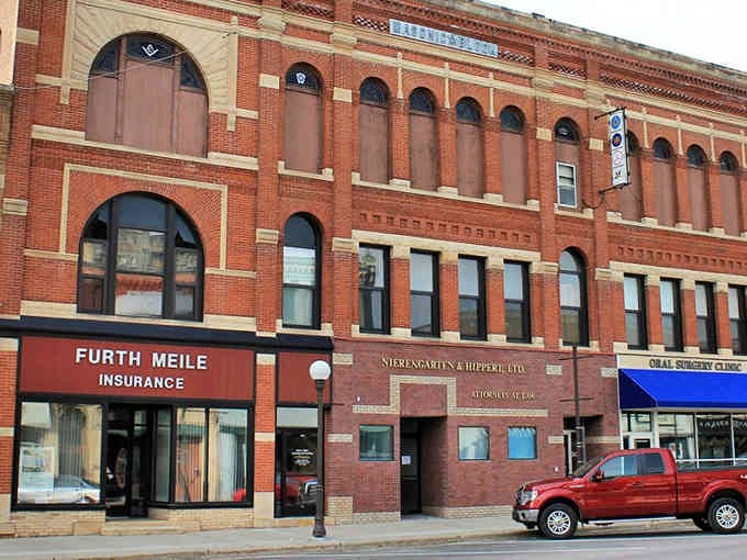 Downtown New Ulm's historic brick buildings whisper stories of German immigrants who built something extraordinary in Minnesota.