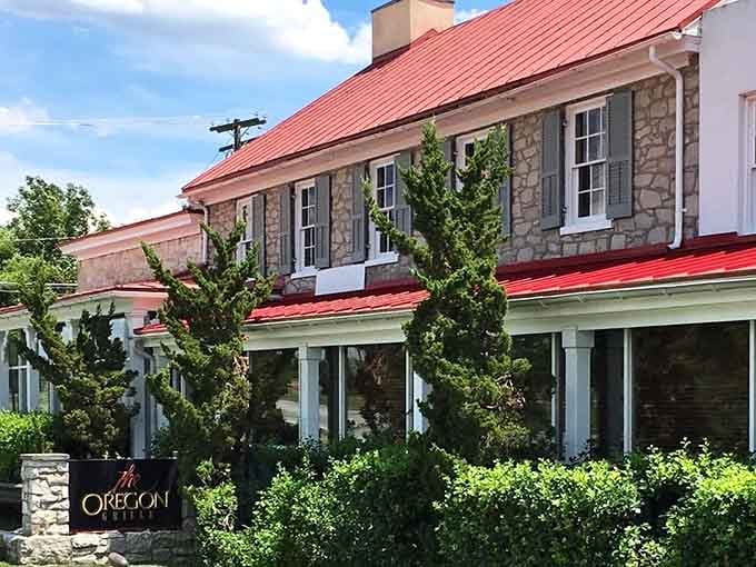 That red roof and stone facade aren't just pretty &ndash; they're your first hint that something special awaits inside.