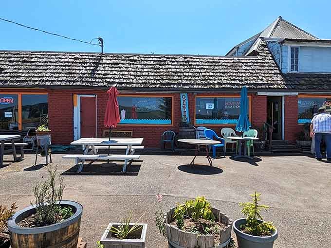 That weathered red exterior and mismatched patio furniture? Classic signs you've found a genuine Pacific Northwest seafood treasure.