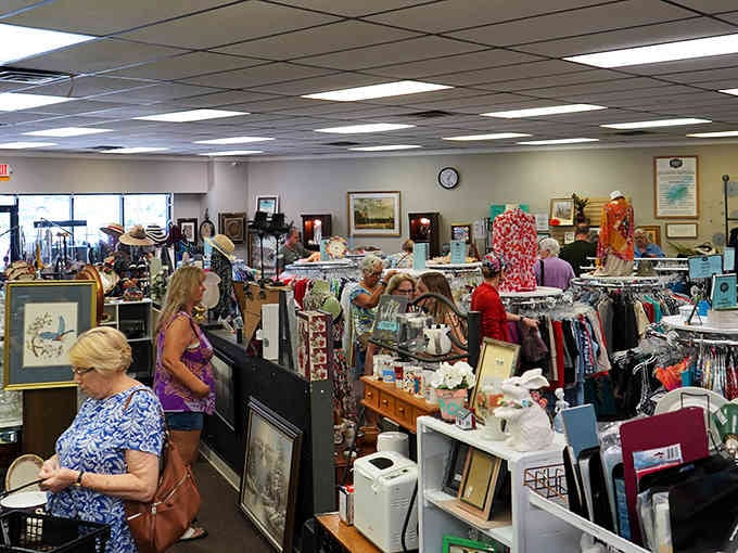 Inside, treasure hunters browse racks where yesterday's castoffs become today's perfect finds at unbeatable prices.