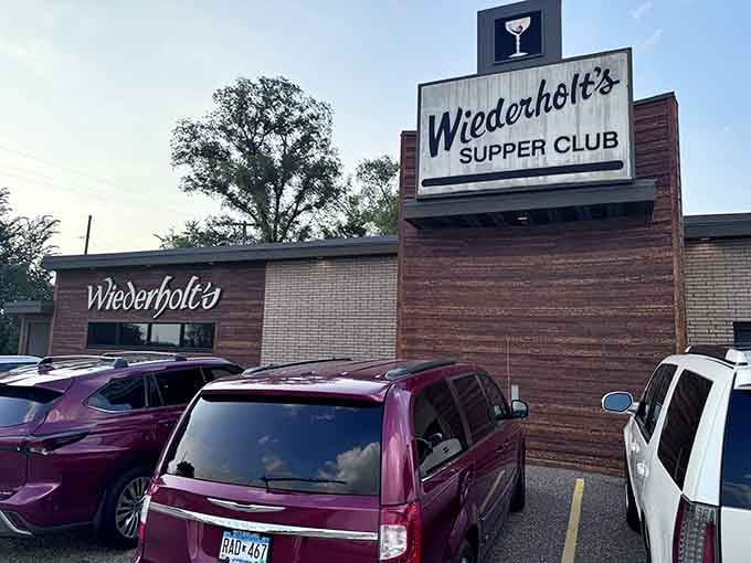 That classic supper club sign with the martini glass icon isn't just decoration, it's a promise of good times ahead.