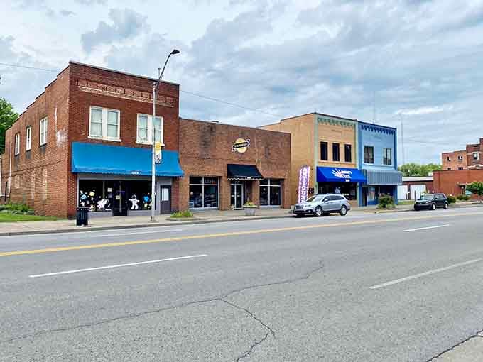 Downtown Middlesboro stretches out like a postcard from America's heartland, mountains standing guard in the distance.