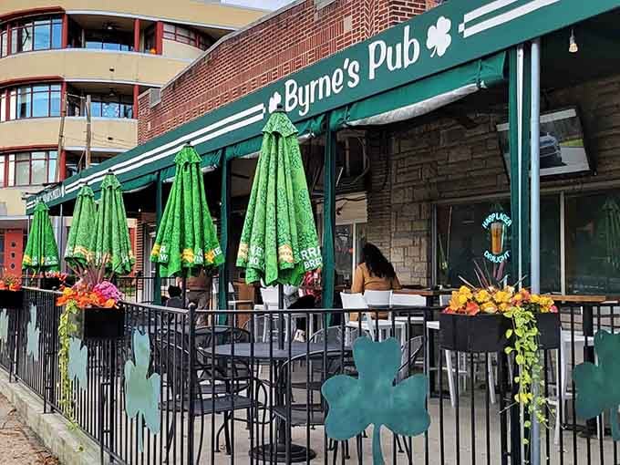 That shamrock-adorned patio with cheerful umbrellas proves the best Irish pub experiences happen when sunshine meets good company.