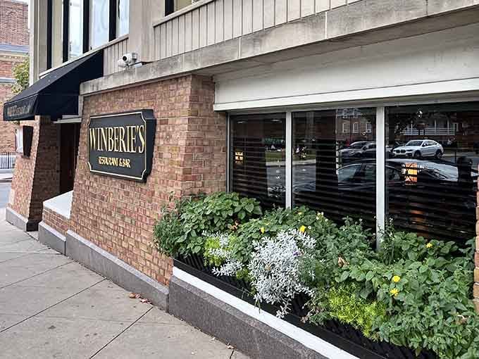The understated storefront with its brick exterior and window boxes shows that great restaurants don't need flashy signs to attract loyal customers.