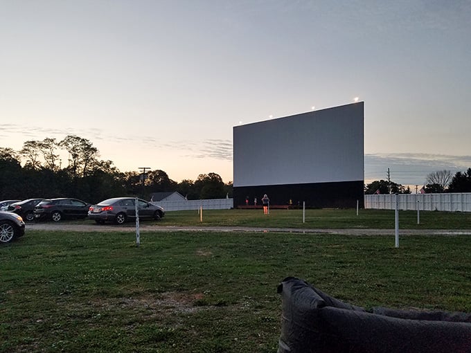 That towering screen against the twilight sky promises an evening of pure, uncomplicated joy ahead.