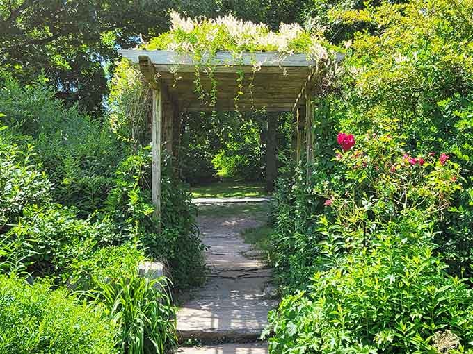 That arbor isn't just an entrance, it's nature's way of saying "leave your stress at the door."