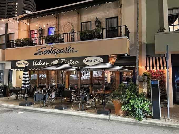 Evening lights transform this bistro into the kind of neighborhood spot where strangers become friends over handmade noodles.