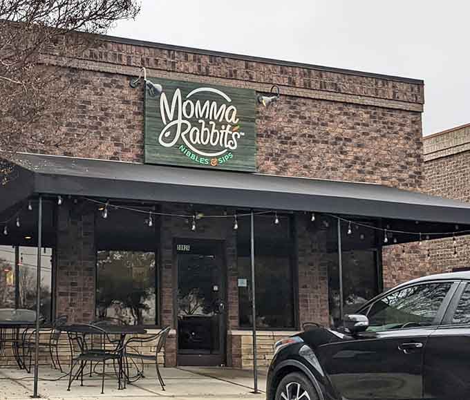 That charming brick facade and twinkling patio lights promise the kind of meal worth canceling other plans for.