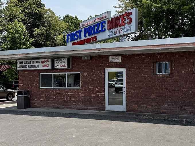 That glowing sign isn't just a marker, it's a beacon calling you home to hot dog heaven.