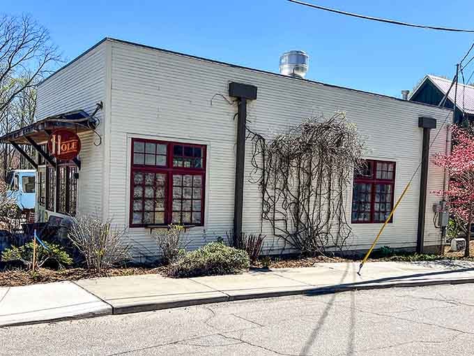 The unassuming white building with red-trimmed windows hides some of North Carolina's most spectacular donuts inside its walls.