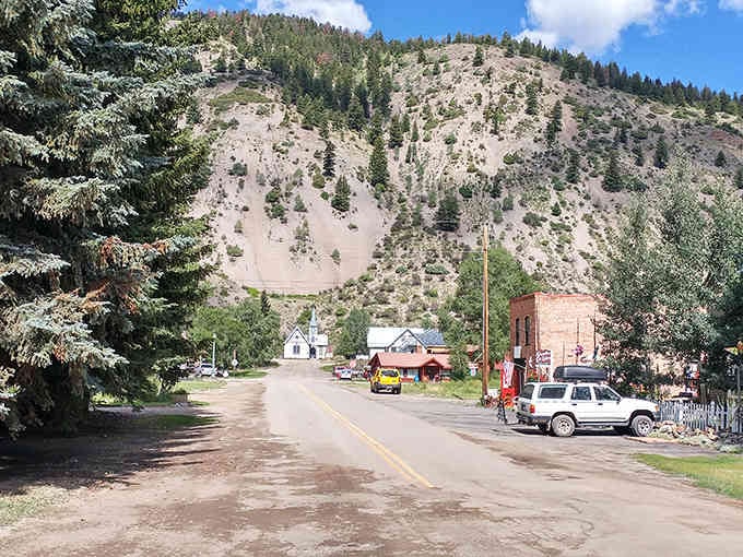 The dramatic mountainside rises above Lake City's quiet streets, reminding visitors why this secluded town remains Colorado's best-kept secret.