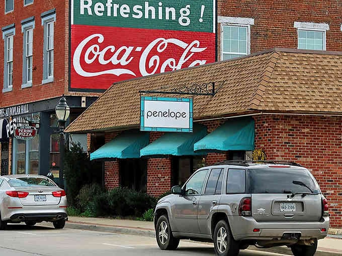 That vintage Coca-Cola sign isn't just decoration, it's a time machine back to when refreshment meant something real.