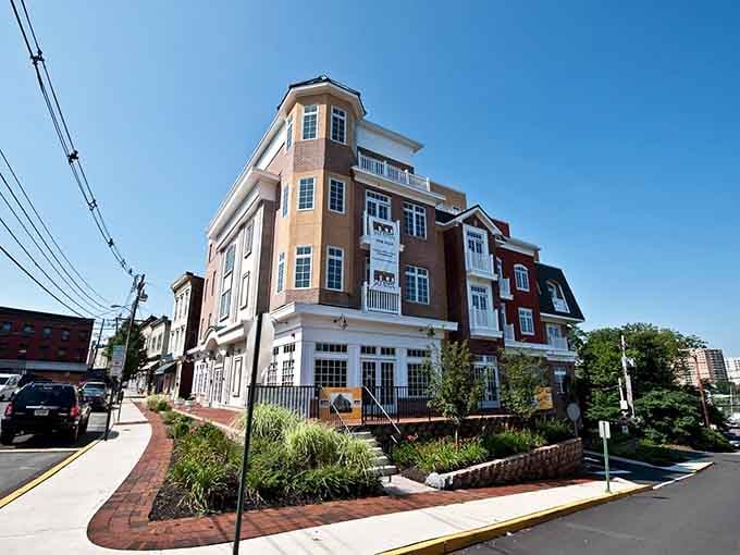 Modern architecture meets small-town charm where brick sidewalks and thoughtful landscaping create an inviting streetscape worth exploring.