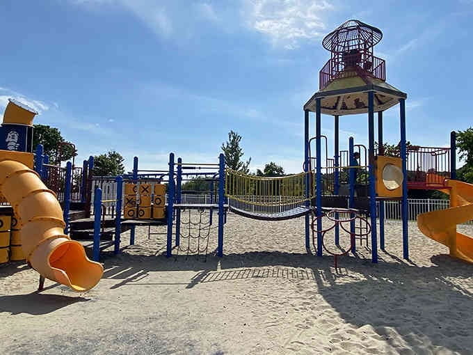 Kids will love this beachside playground featuring twisting slides and climbing structures with sand beneath their feet for safe landings.