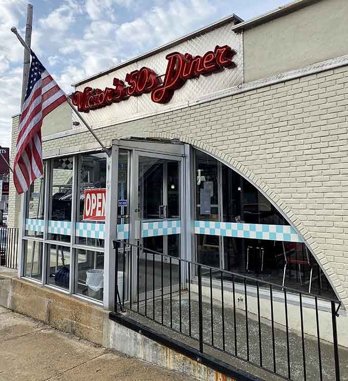 That neon script and classic architecture promise a time when diners were America's living rooms.
